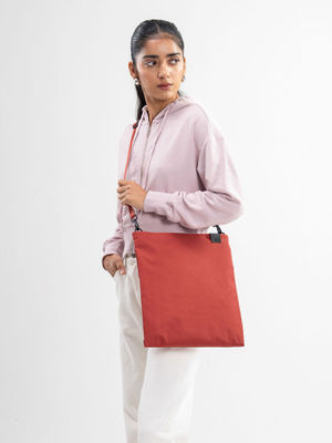 Buy DailyObjects Unisex Solid Coral Pivot Expandable Sling Bag (S) Online