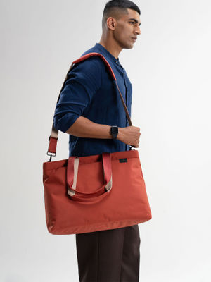 Buy DailyObjects Unisex Solid Pivot Weekender Duffle Bag - Coral Online