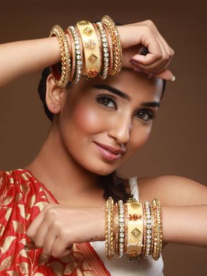 Buy Aatmana Gold Plated White Stone Studded & Beaded Cream Chuda ...