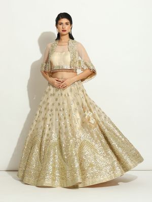 Buy VANDANA SETHI Ivory Shimmer Organza Lehenga with a Shrug in Goat ...