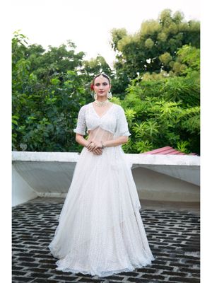 Buy Tanu Malhotra Ivory Net Embroidered Flowy Lehenga with Blouse and ...